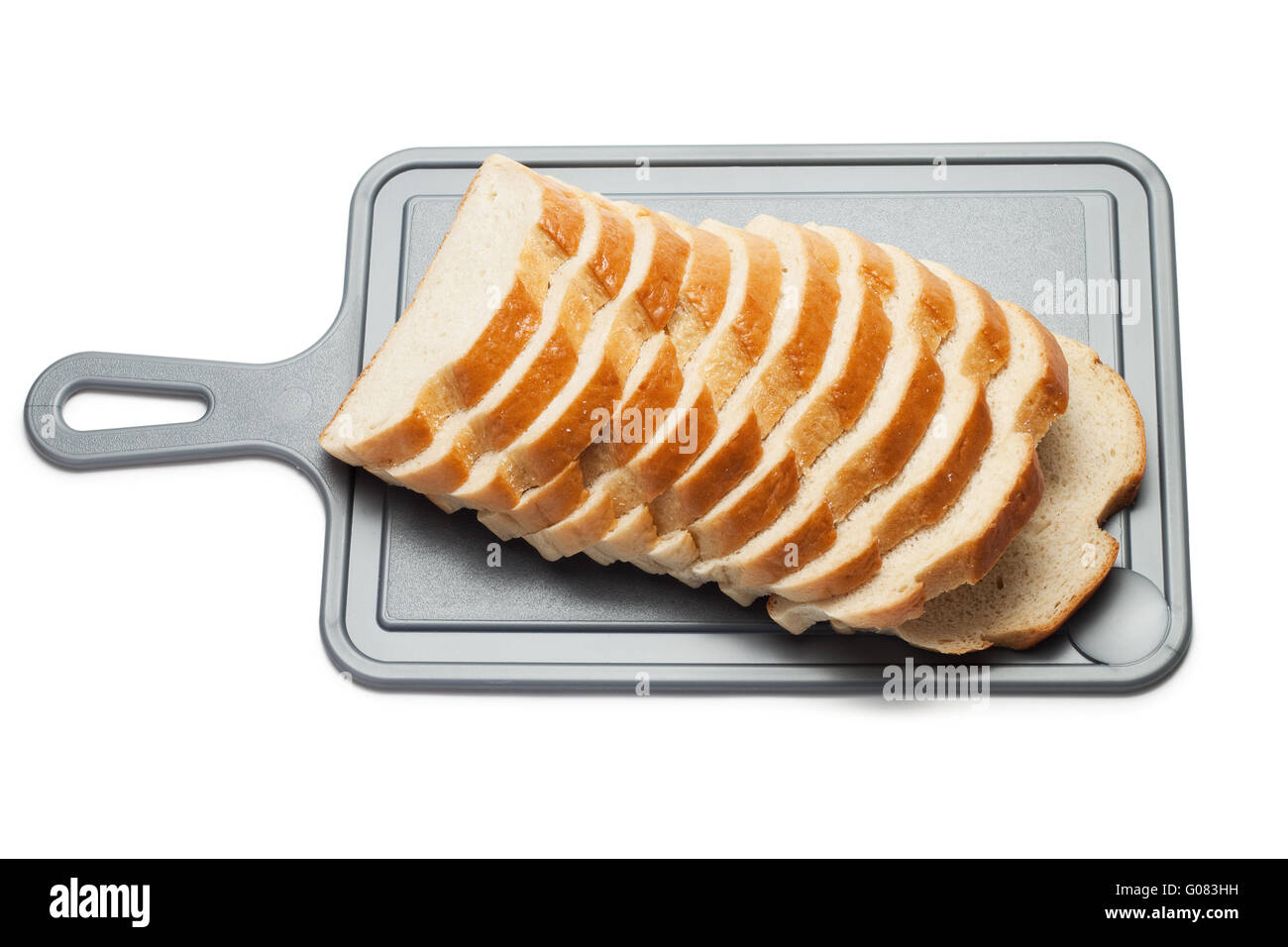 sliced bread on breadboard isolated over white Stock Photo - Alamy