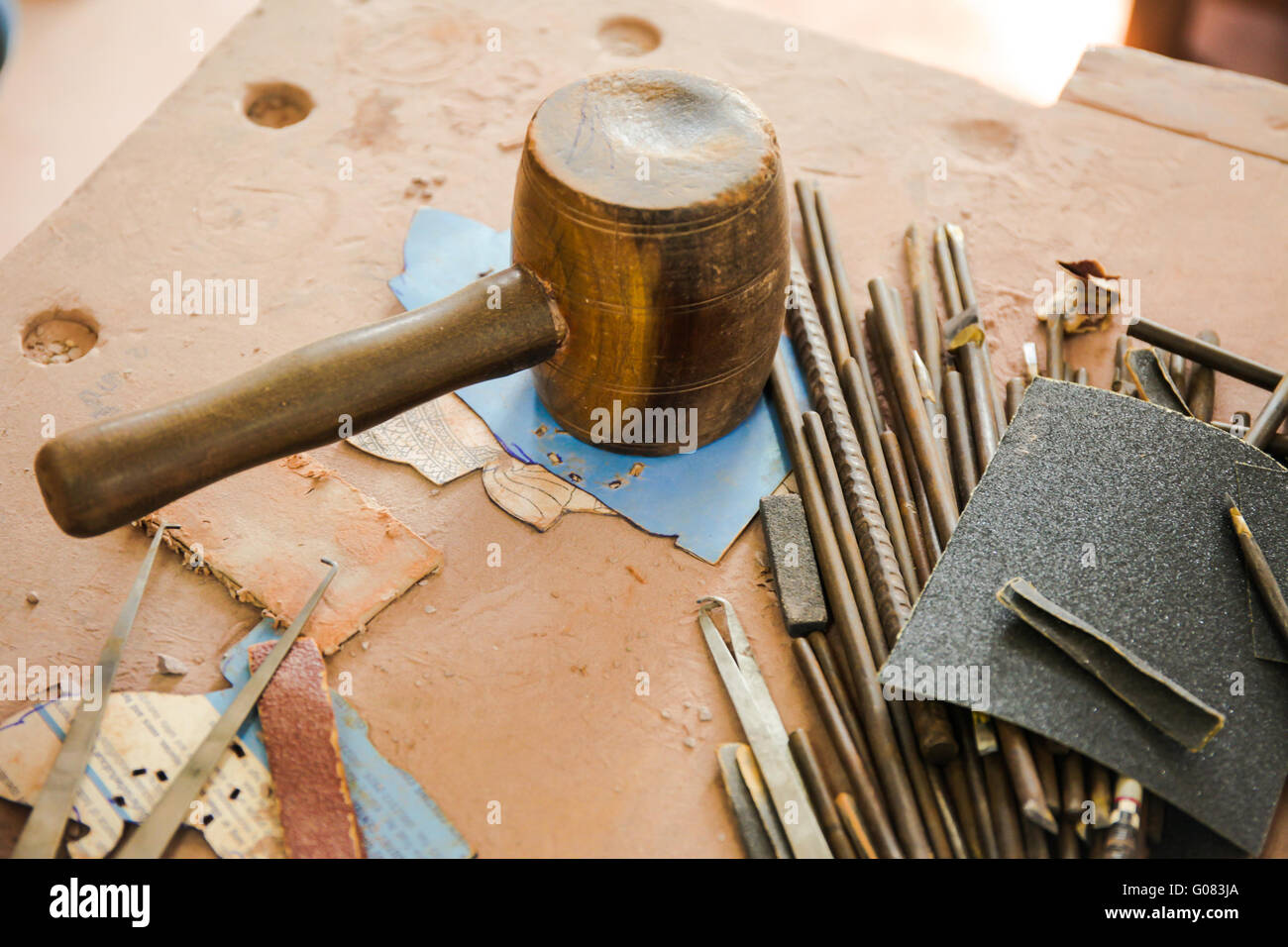 Various kinds of Sculpting Tools laying down on dirty wooden table ...