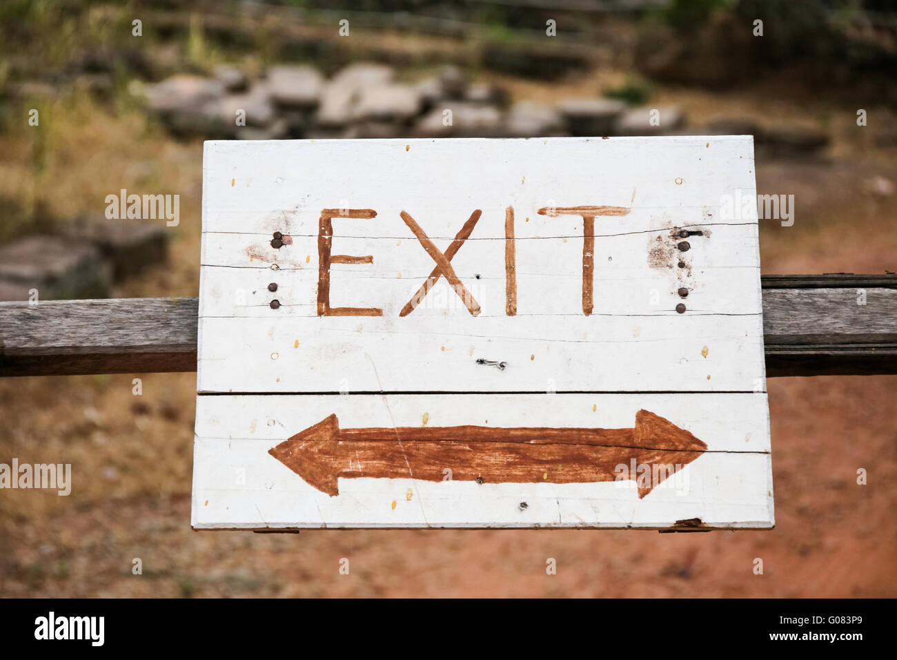 Exit sign made of wood in forest background Stock Photo - Alamy