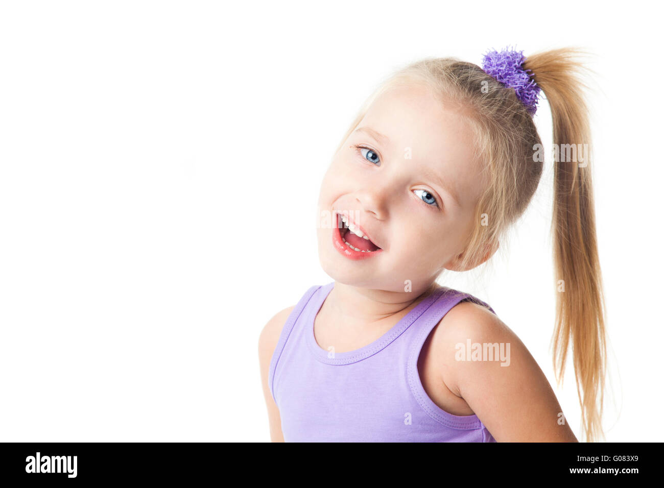 smiling little girl in purple t-shirt isolated Stock Photo - Alamy