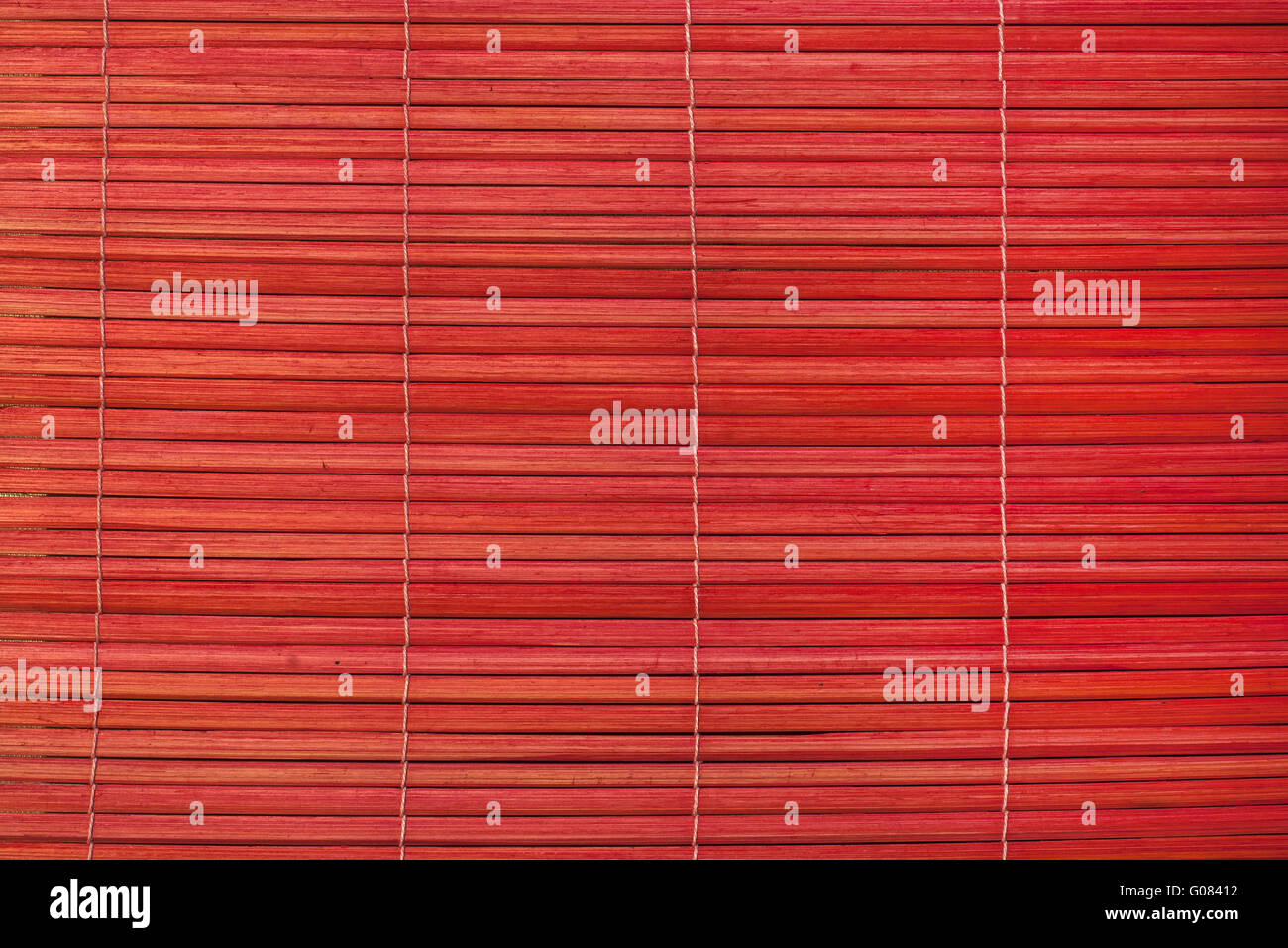 Red reed mat texture closeup as background Stock Photo - Alamy