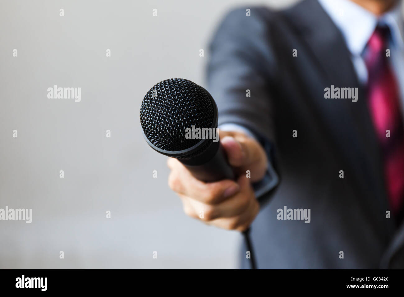 Black man male tv journalist reporter media holding microphone speaking ...