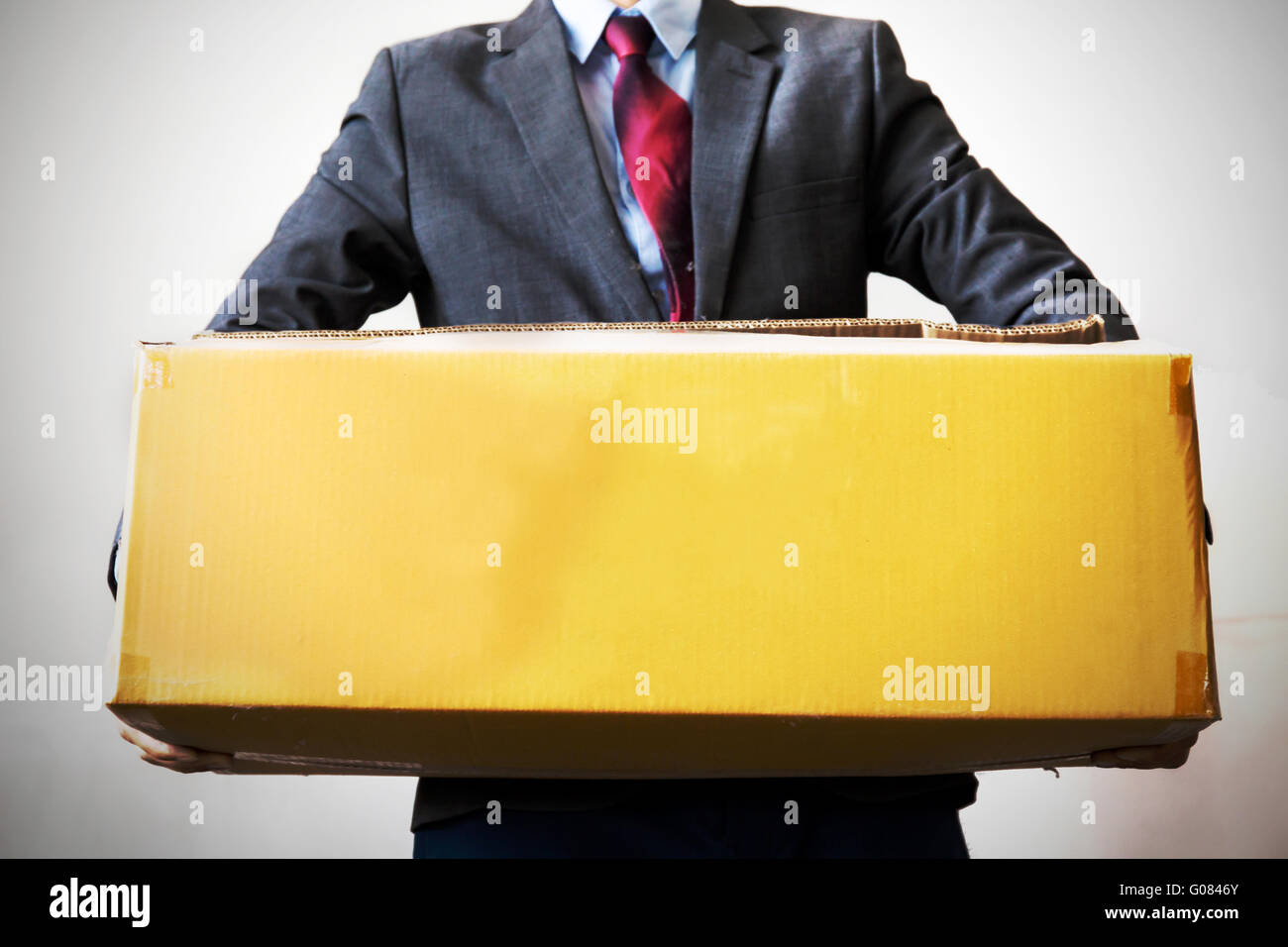 Business man carrying an old box with hard work - empty box ready to ...