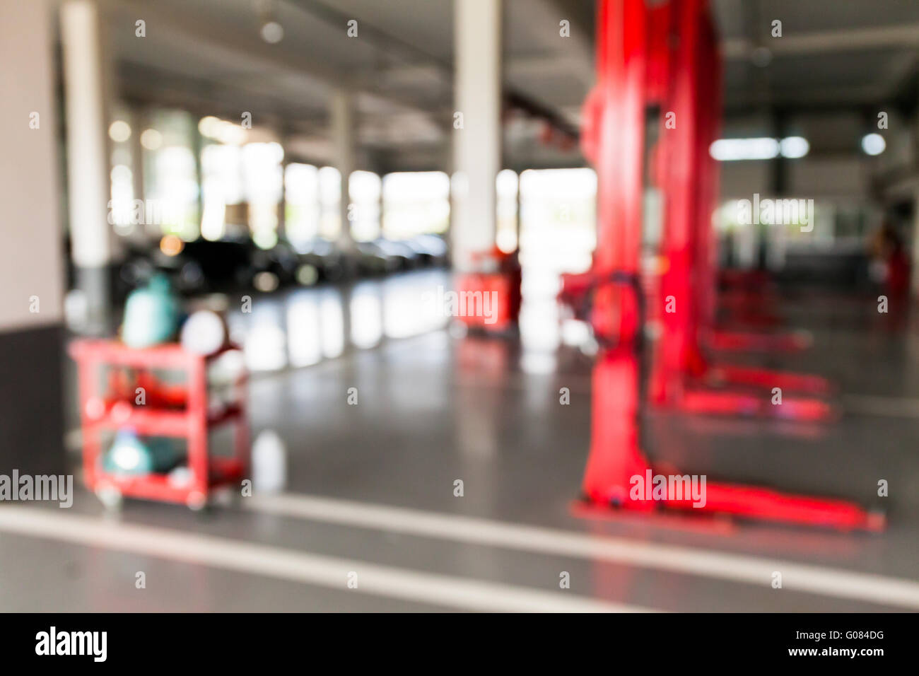Blurred of inside car garage for background Stock Photo - Alamy