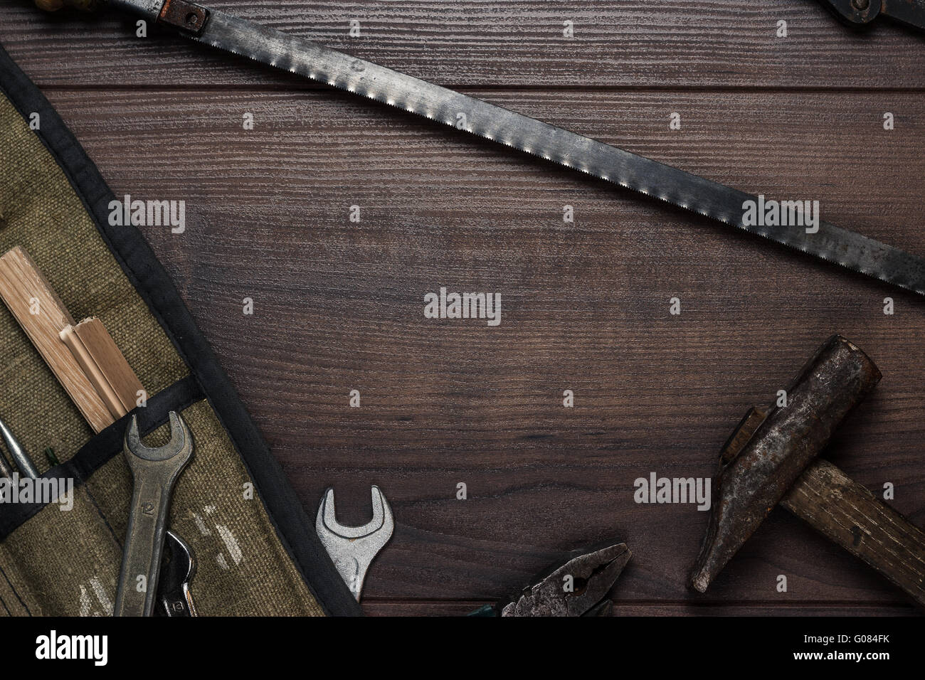 old rusty construction instruments on the wooden b Stock Photo - Alamy