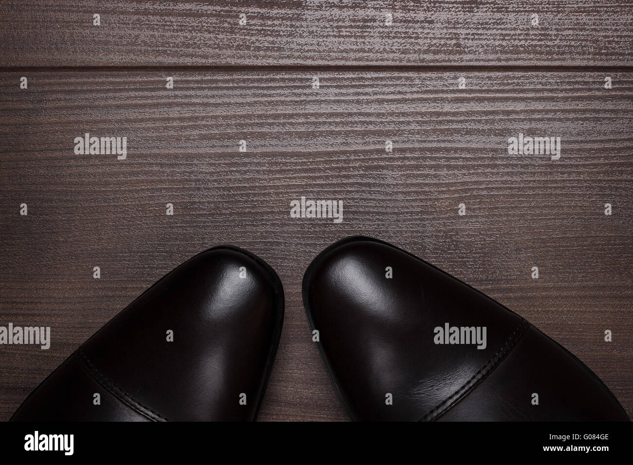 shy man standing on the wooden floor background Stock Photo - Alamy