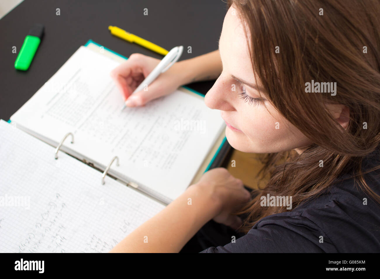 Young lady writing note hi-res stock photography and images - Alamy