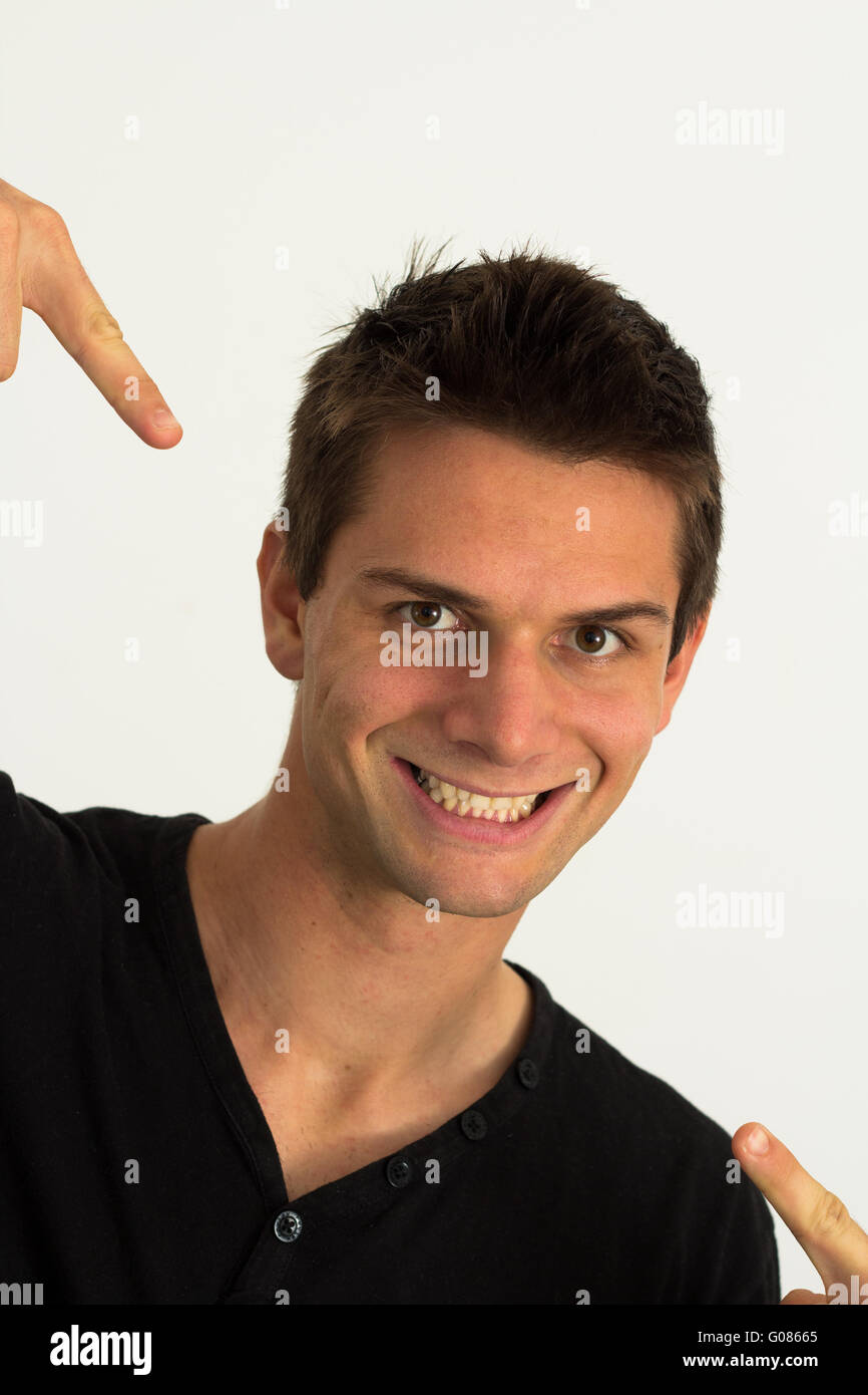 Young man smiling and pointing at himself with success Stock Photo - Alamy