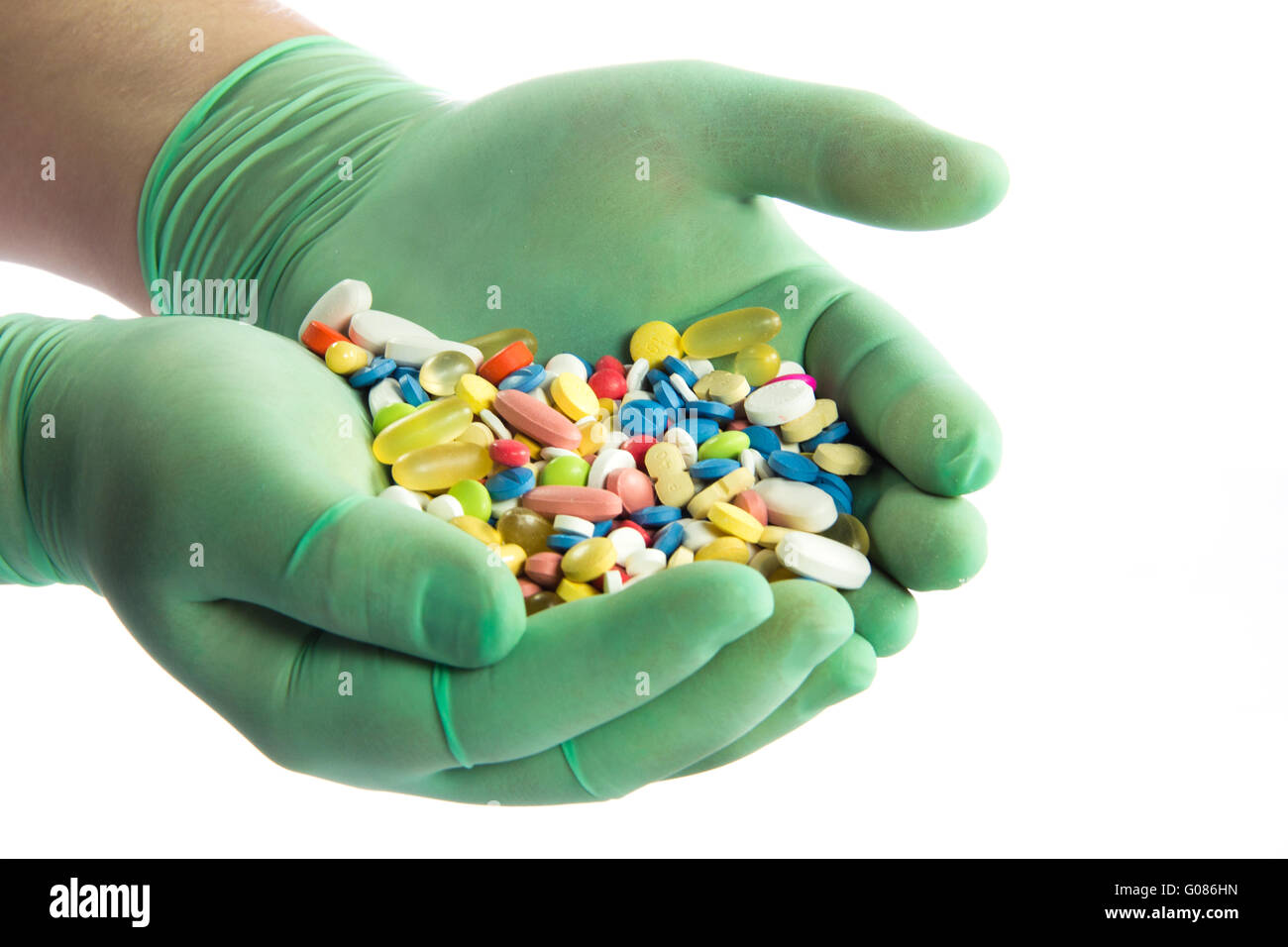Hand with pills. Many colorful pills on two hands Stock Photo - Alamy