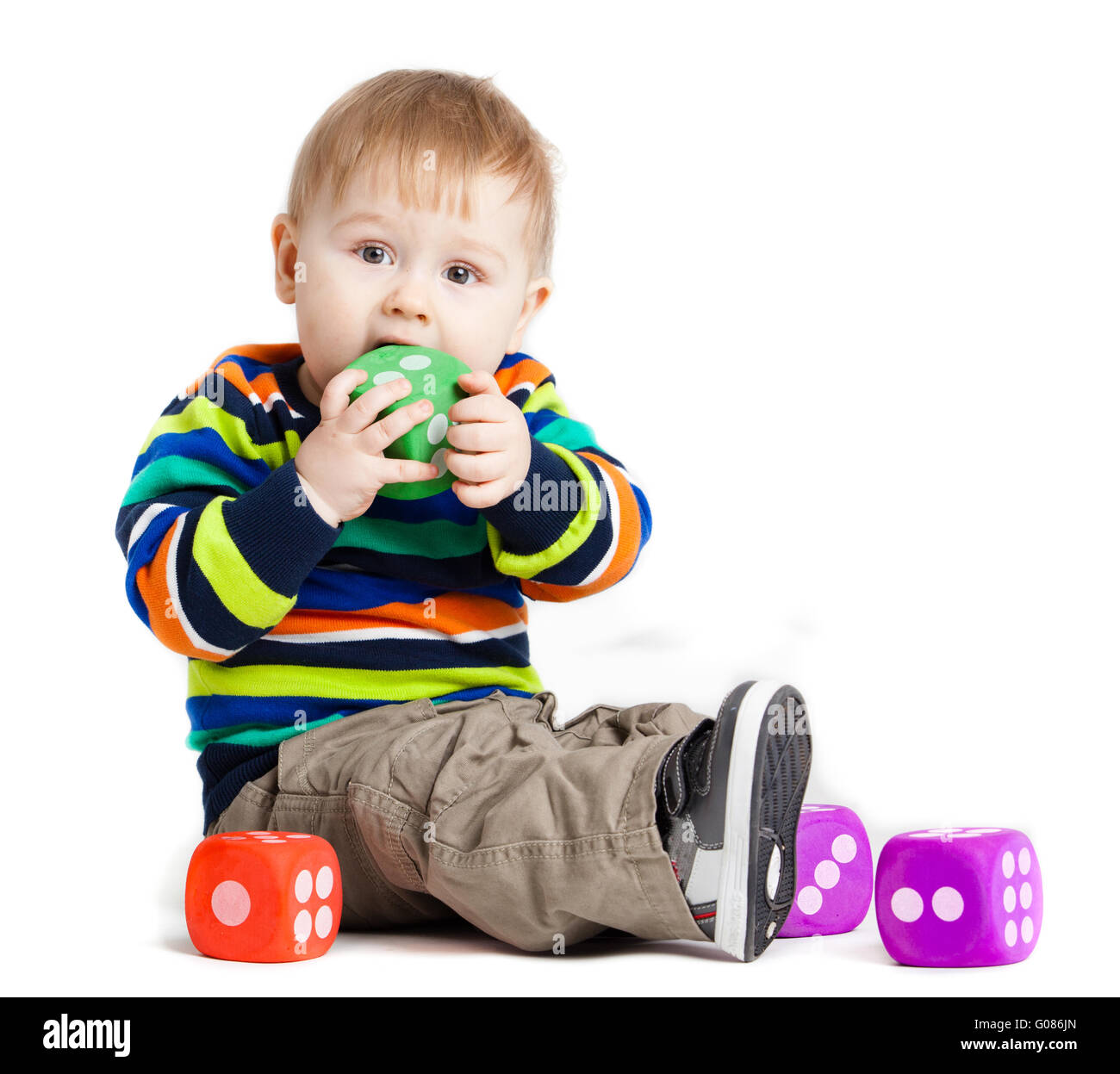 baby is playing with toys over white background Stock Photo - Alamy