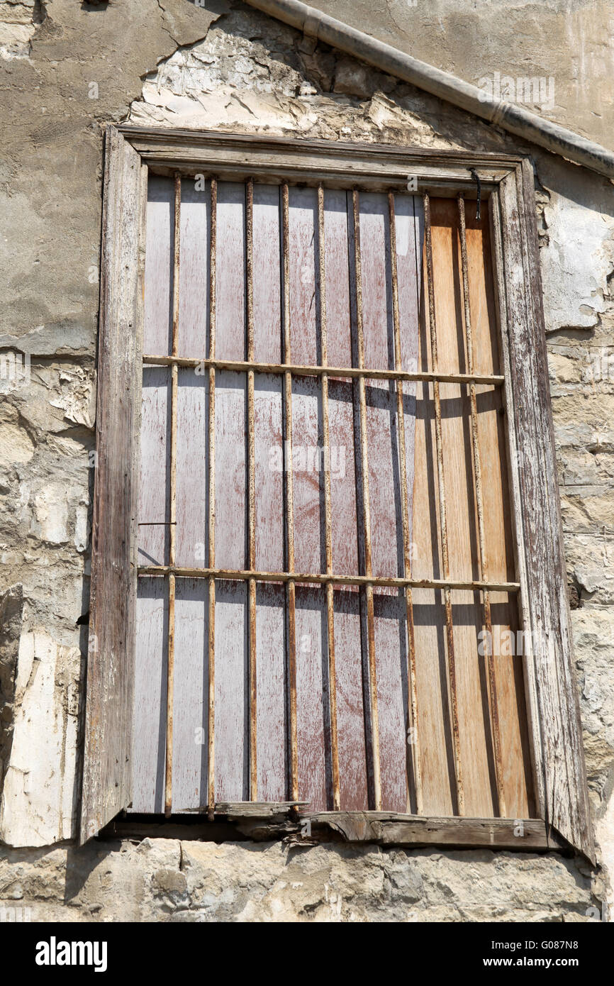 Old locked window with lattice in vintage wall Stock Photo - Alamy