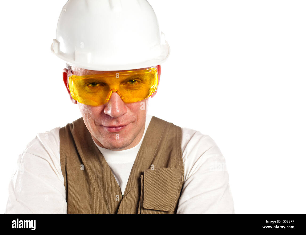 The man, the builder, in goggles and a helmet Stock Photo - Alamy