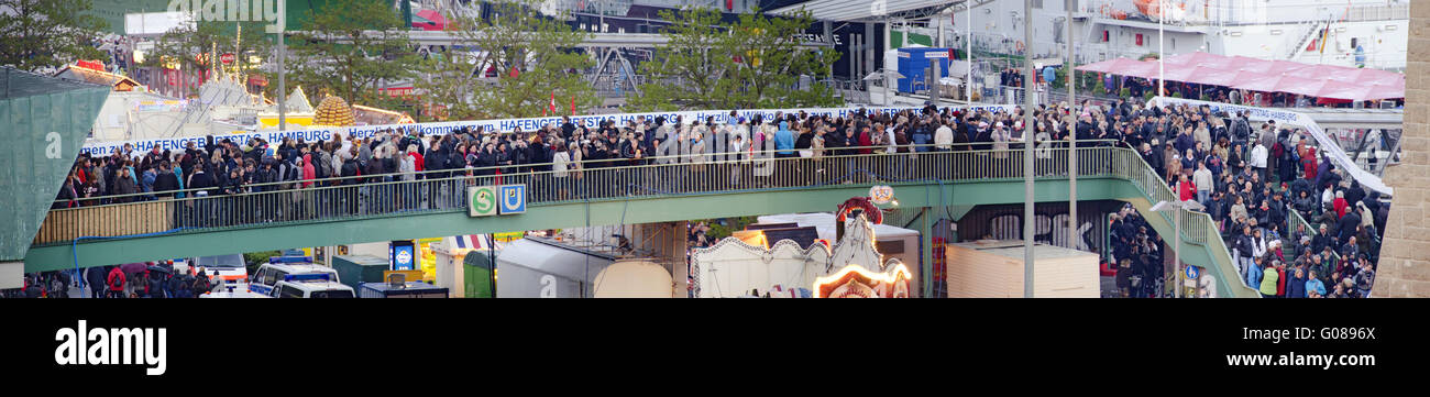 crowd of people at the access to the harbour Stock Photo - Alamy