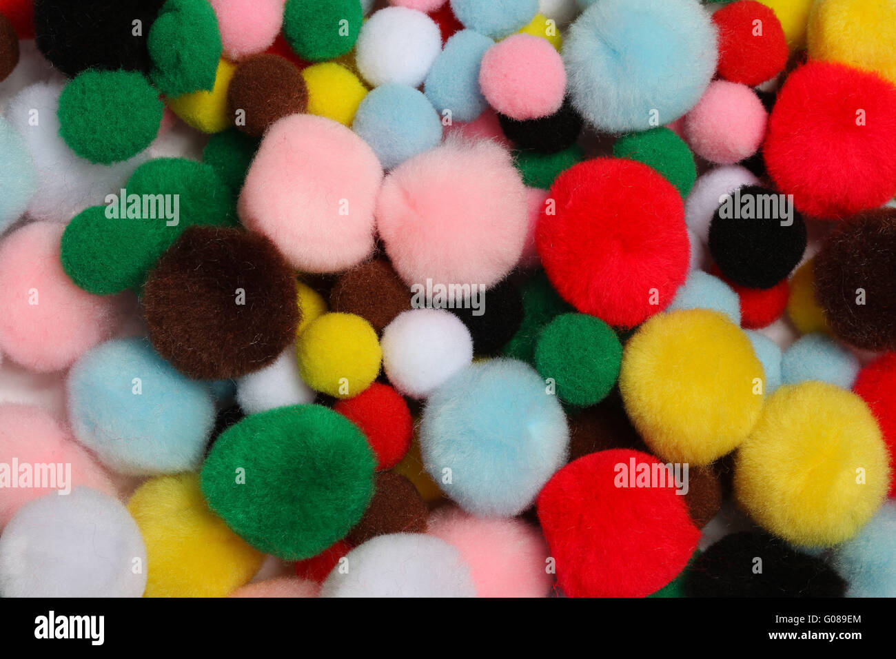 Pom-poms multicolored background Stock Photo - Alamy