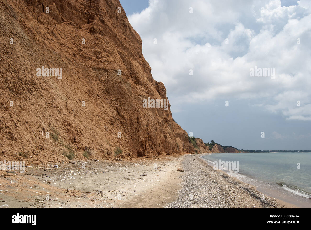 Eroded sea coastline on blue sky in sunny day Stock Photo - Alamy