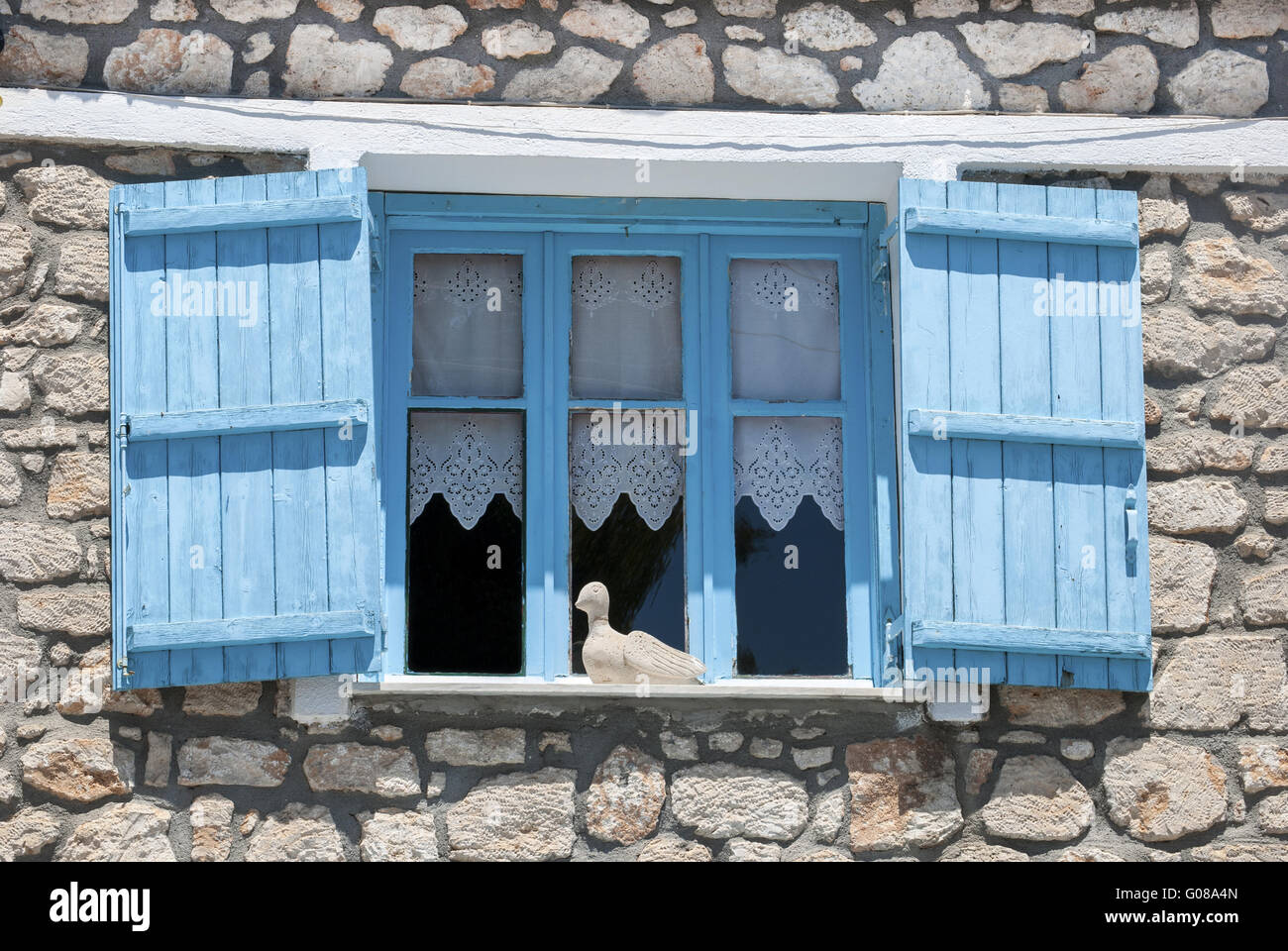 Window of stone house with bright blue wooden shut Stock Photo - Alamy