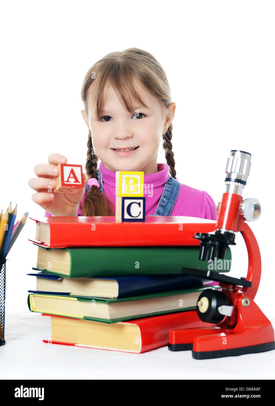 The little girl learn isolated on white background Stock Photo - Alamy