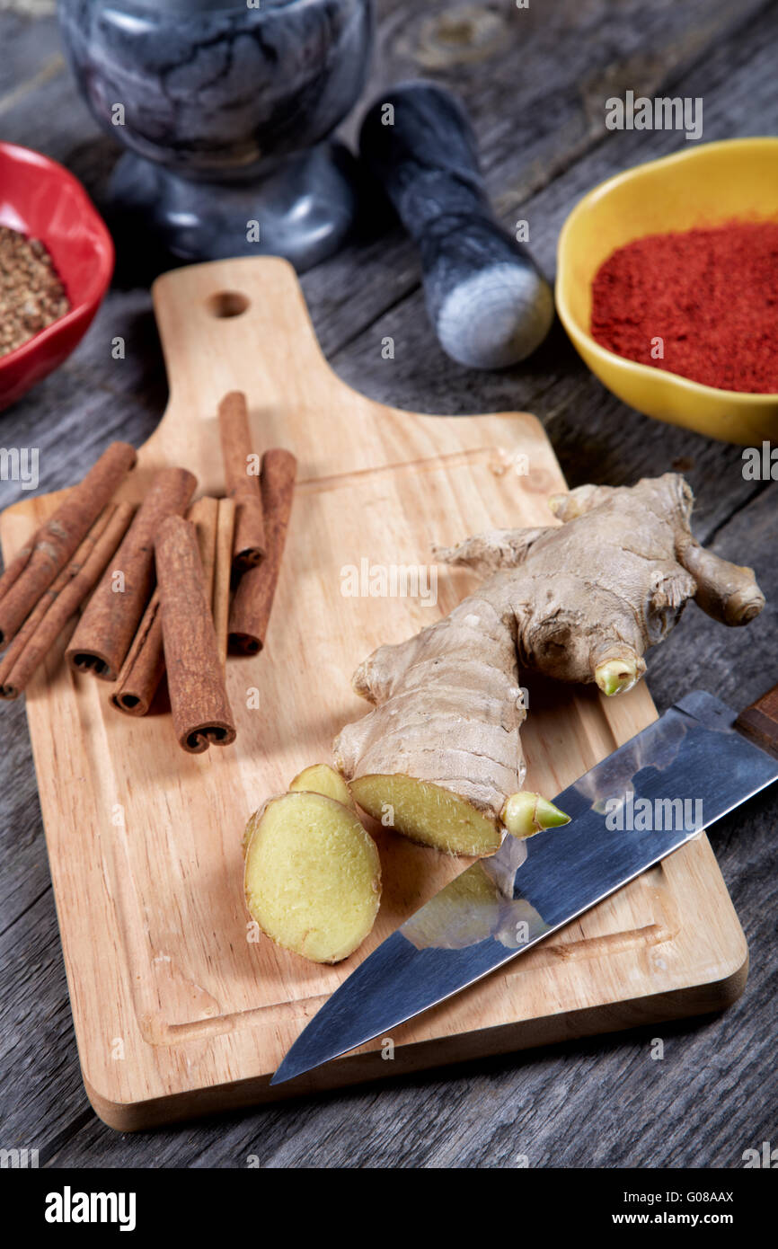 Still-life with ginger and cinnamon on an old kitchen table Stock Photo ...