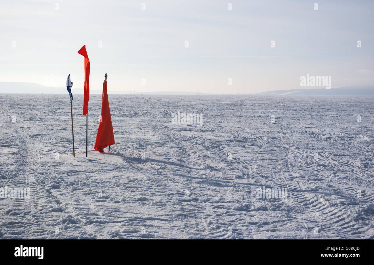 flag in the snow Stock Photo - Alamy