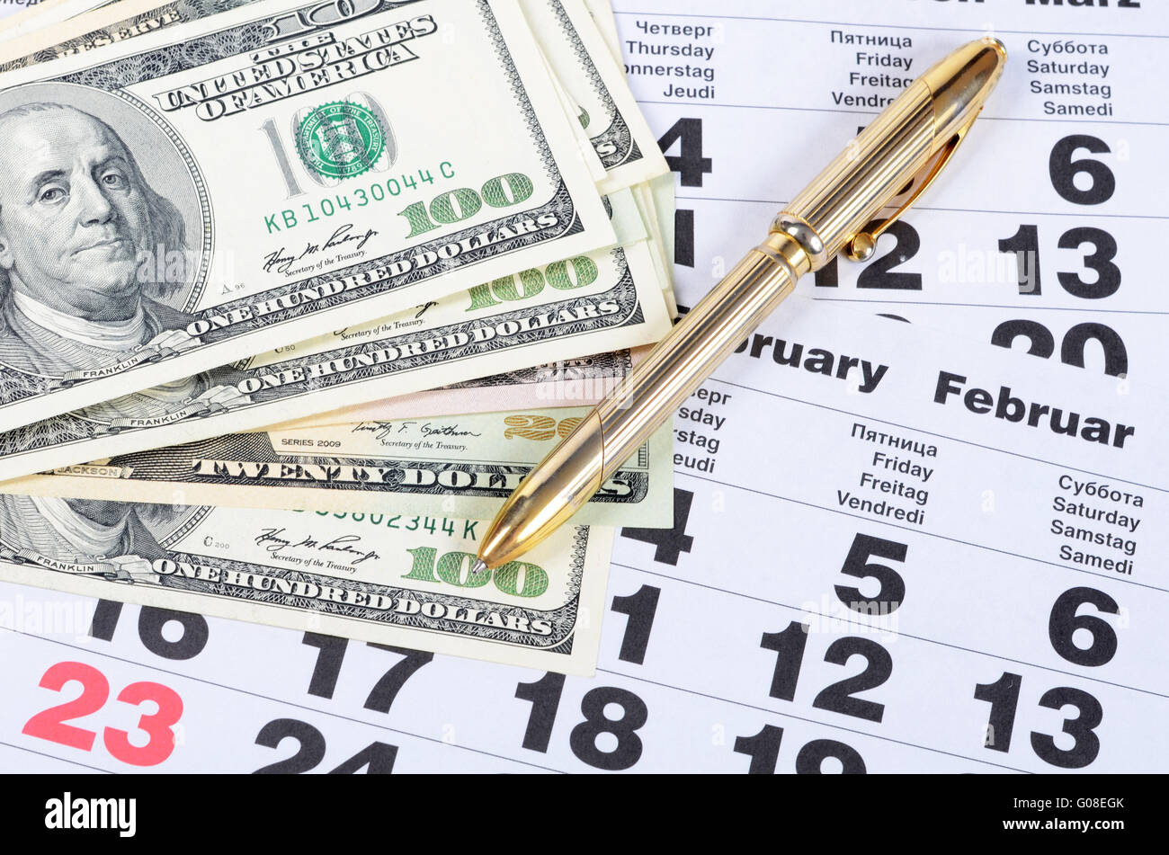 Banknotes of dollars on calendar sheets closeup Stock Photo - Alamy