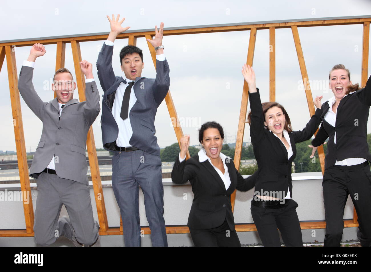 Successful business team cheering and rejoicing Stock Photo - Alamy