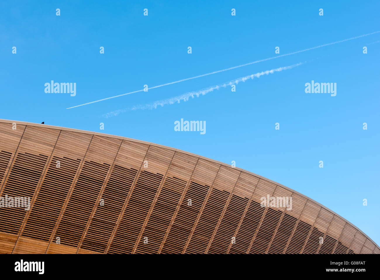 Velodrome by Hopkins Architects wooden curved roof and plane in London ...