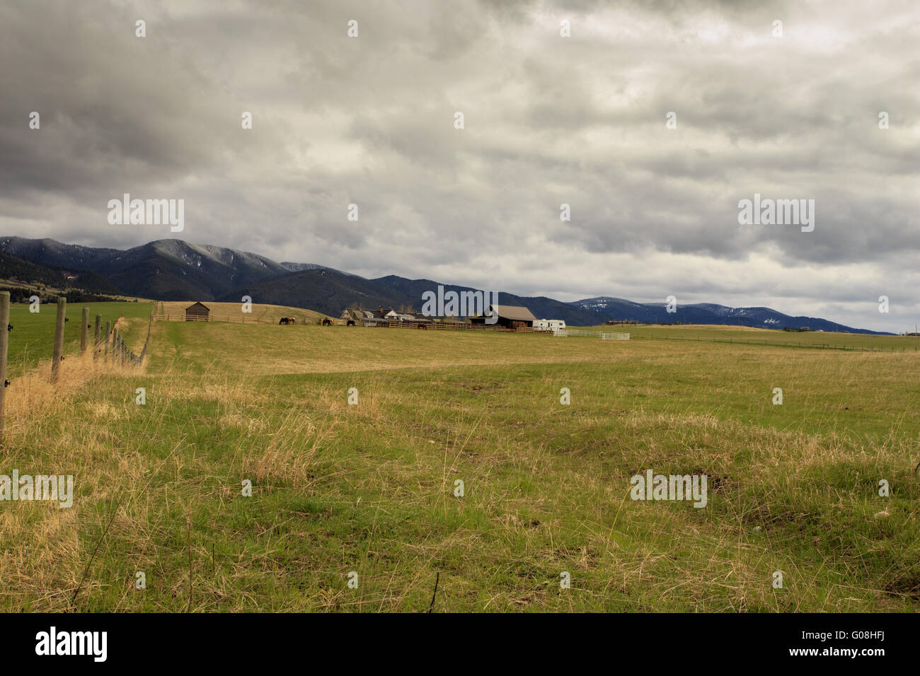 Landscape with cabin on a Montana Ranch. Mountains in background Stock ...