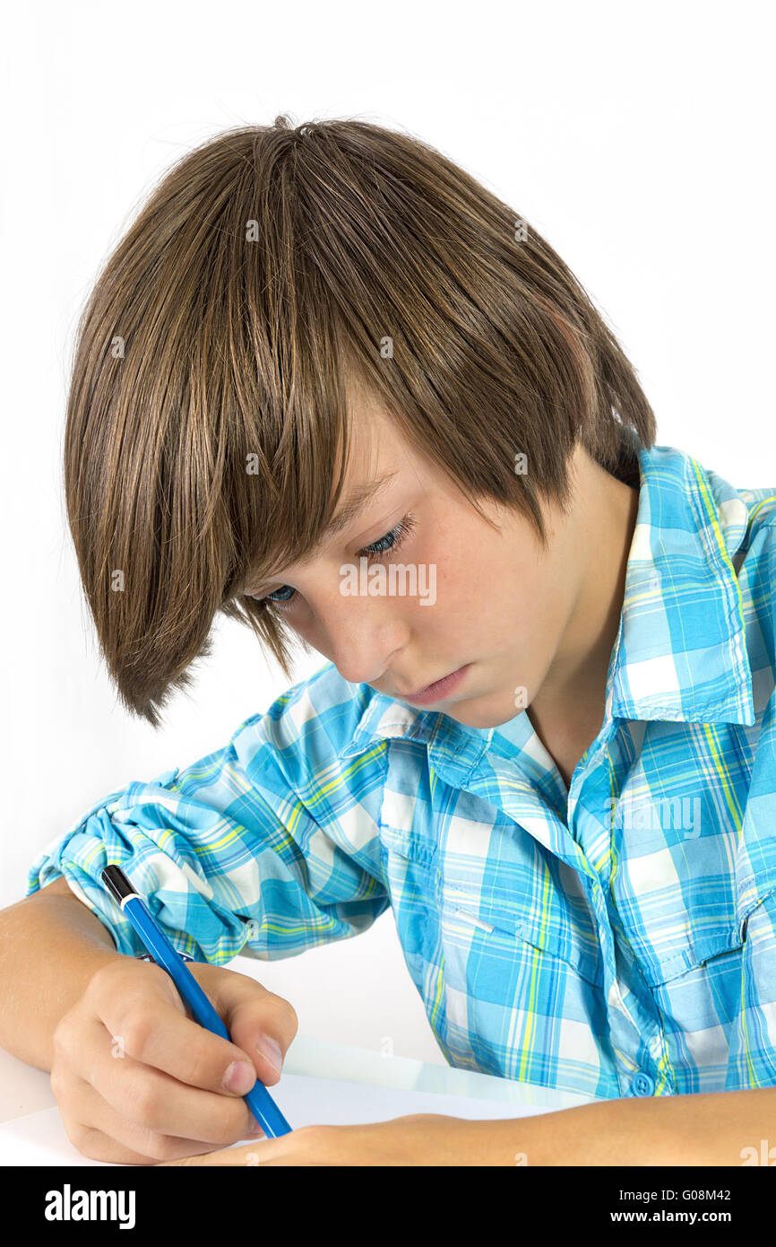 school boy with pencil works concentrated, isolated on white Stock ...