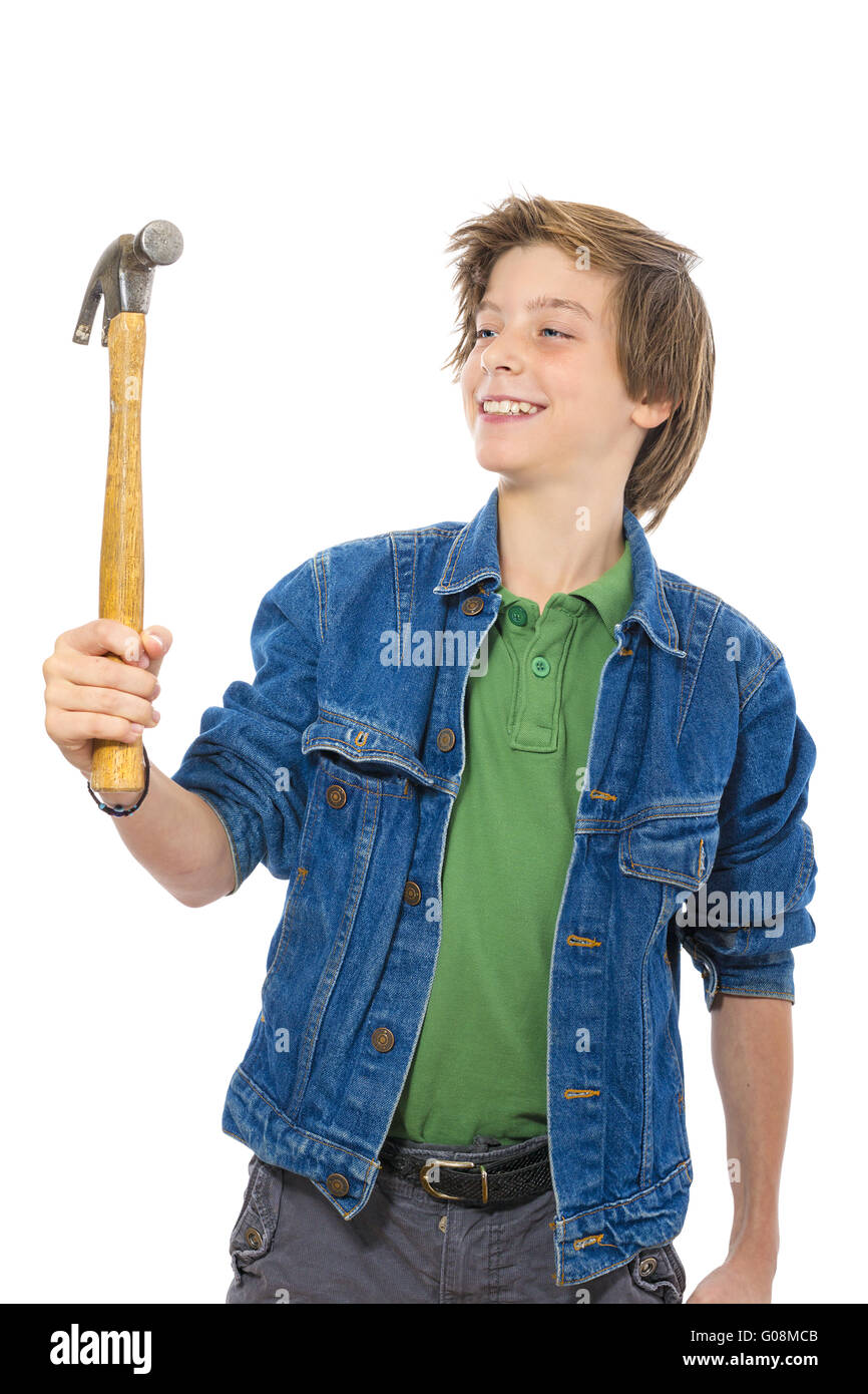 confident teenage boy smiling to a hammer in his hand, isolated on ...