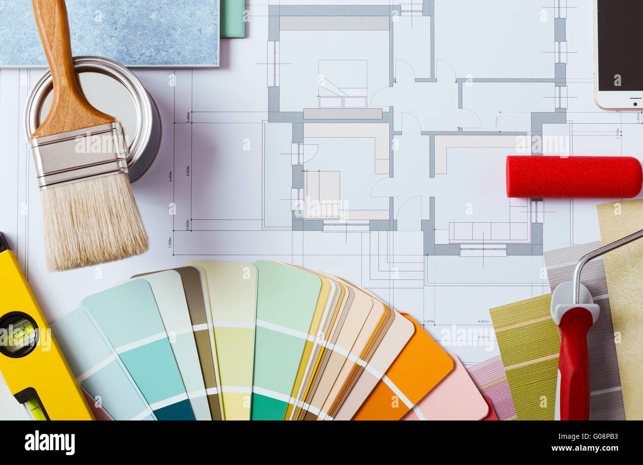 Painter and decorator work table with house project, color swatches ...