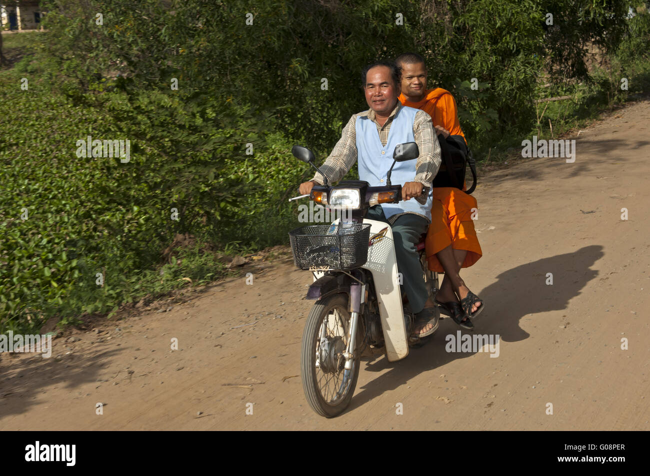 Monk buddhist riding motorcycle hi-res stock photography and images - Alamy