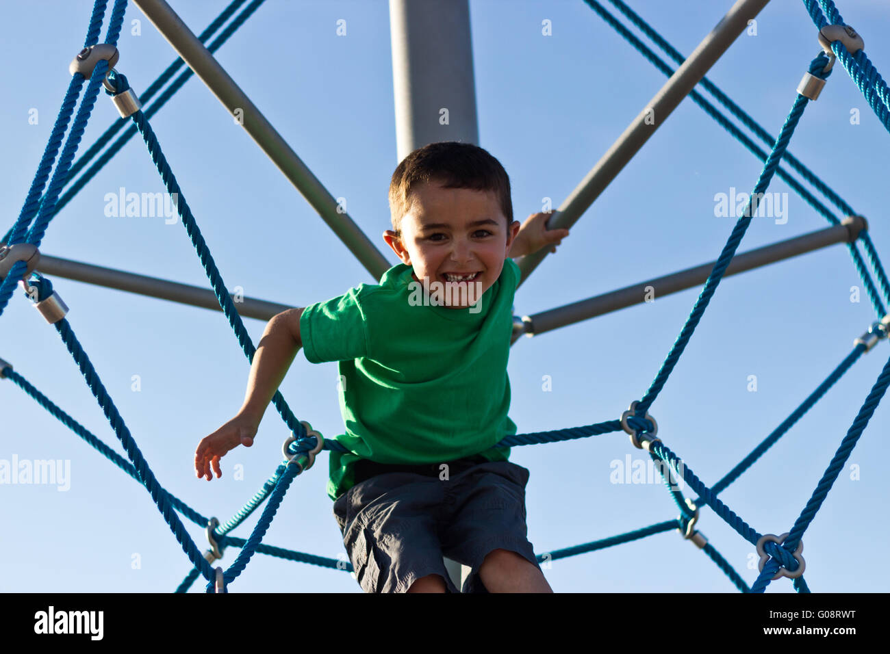 Child playing on the play structure in the park Stock Photo - Alamy