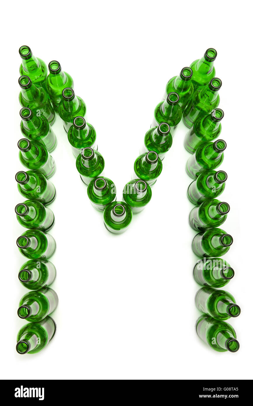 The alphabet from glass beer bottles. Letter M Stock Photo - Alamy