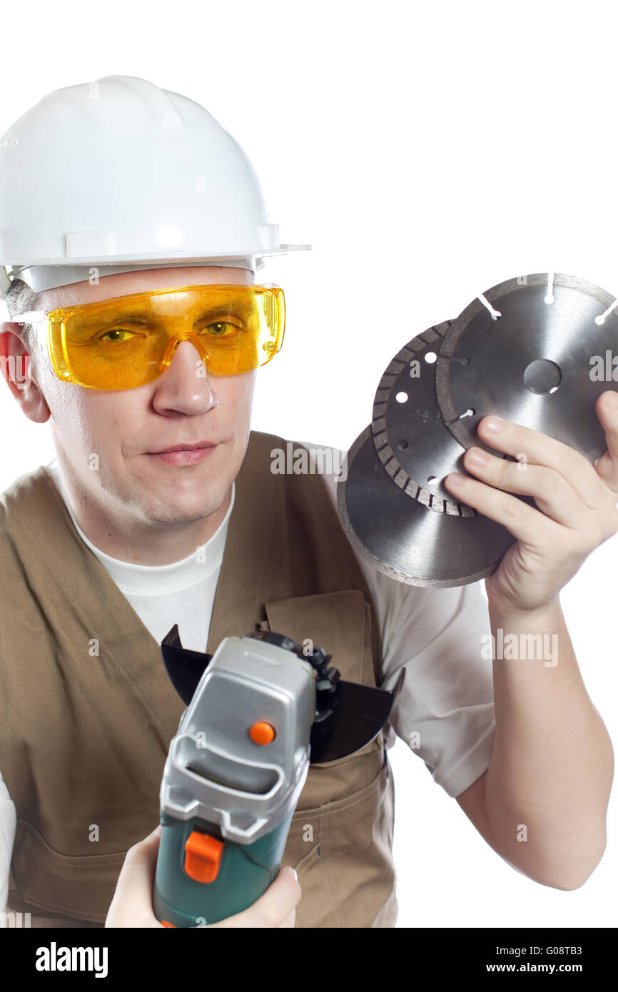The man, the builder, in goggles and a helmet Stock Photo - Alamy