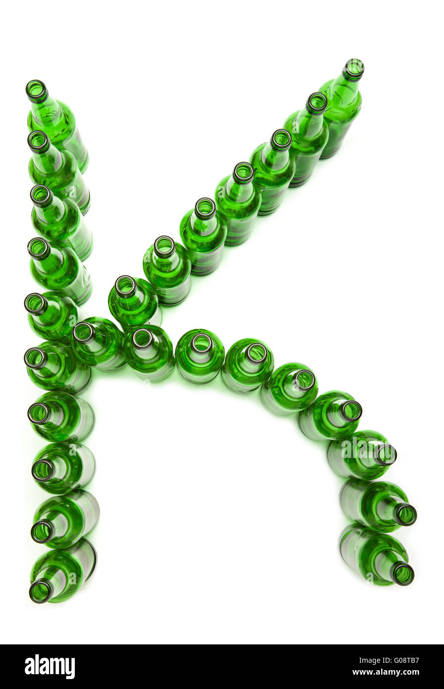 The alphabet from glass beer bottles. Letter K Stock Photo - Alamy
