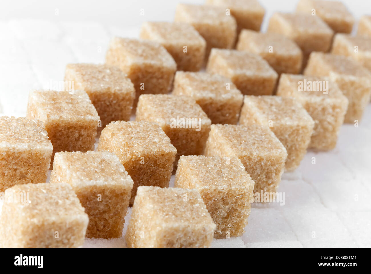 Cubes of not refined reed sugar and white sugar Stock Photo - Alamy