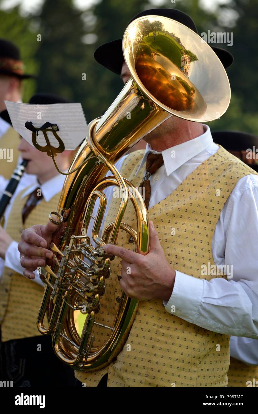 Musicians in traditional dress playing tenor horn Stock Photo - Alamy