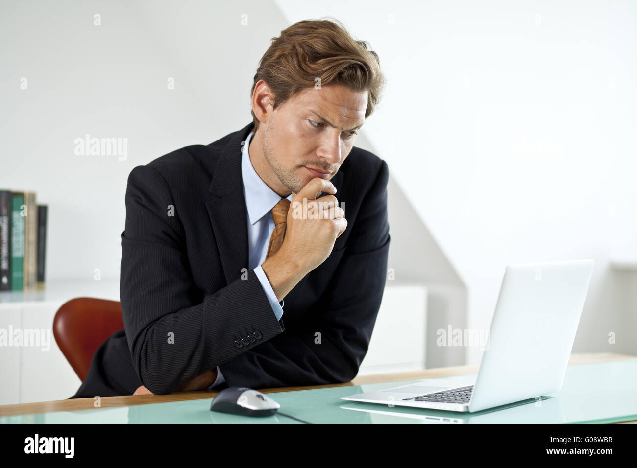 Confused businessman in front of computer hi-res stock photography and ...