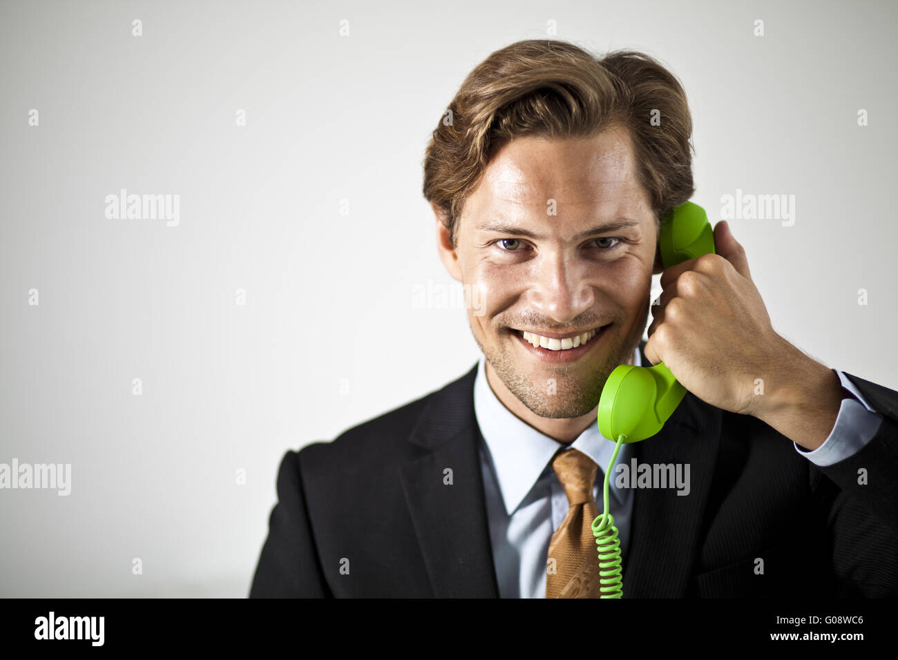 Answering the phone Stock Photo - Alamy