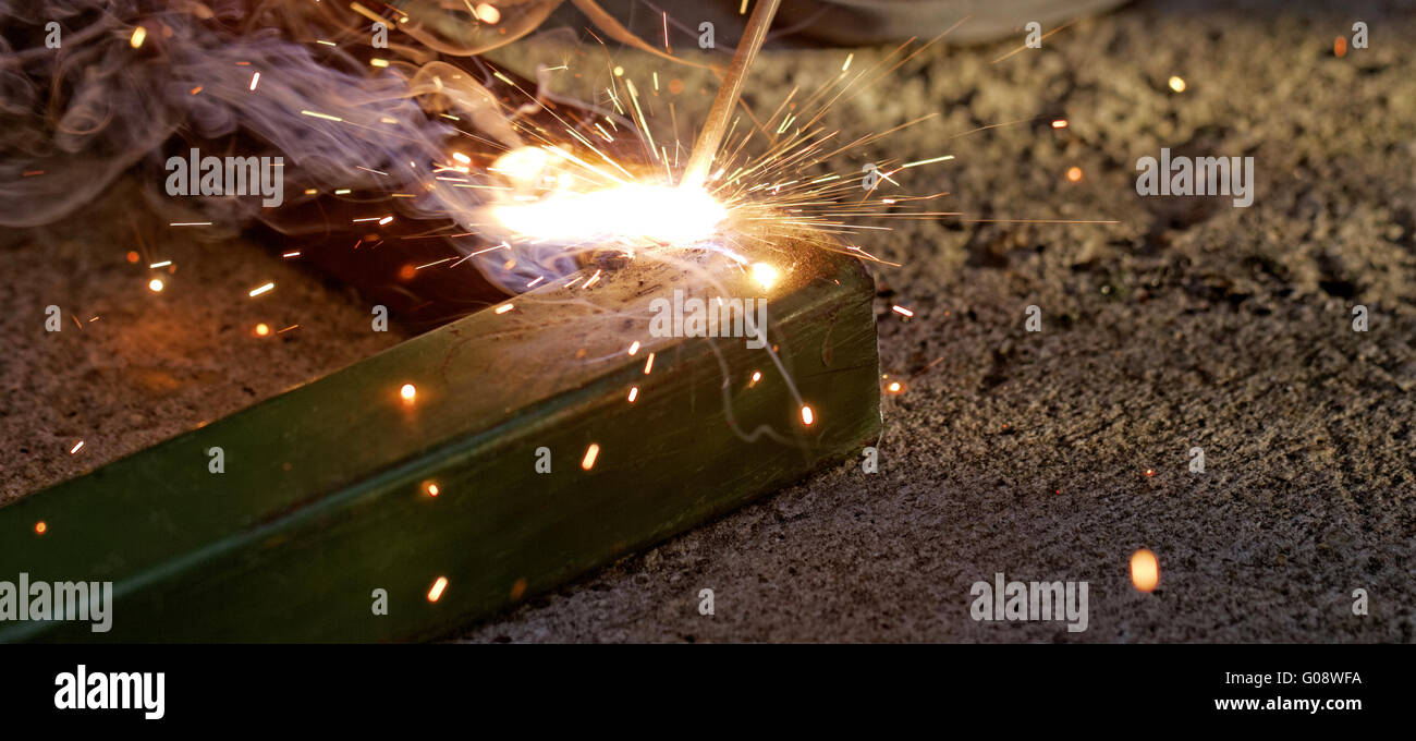 Iron welding with bright light and smoke at manufacturing Stock Photo ...