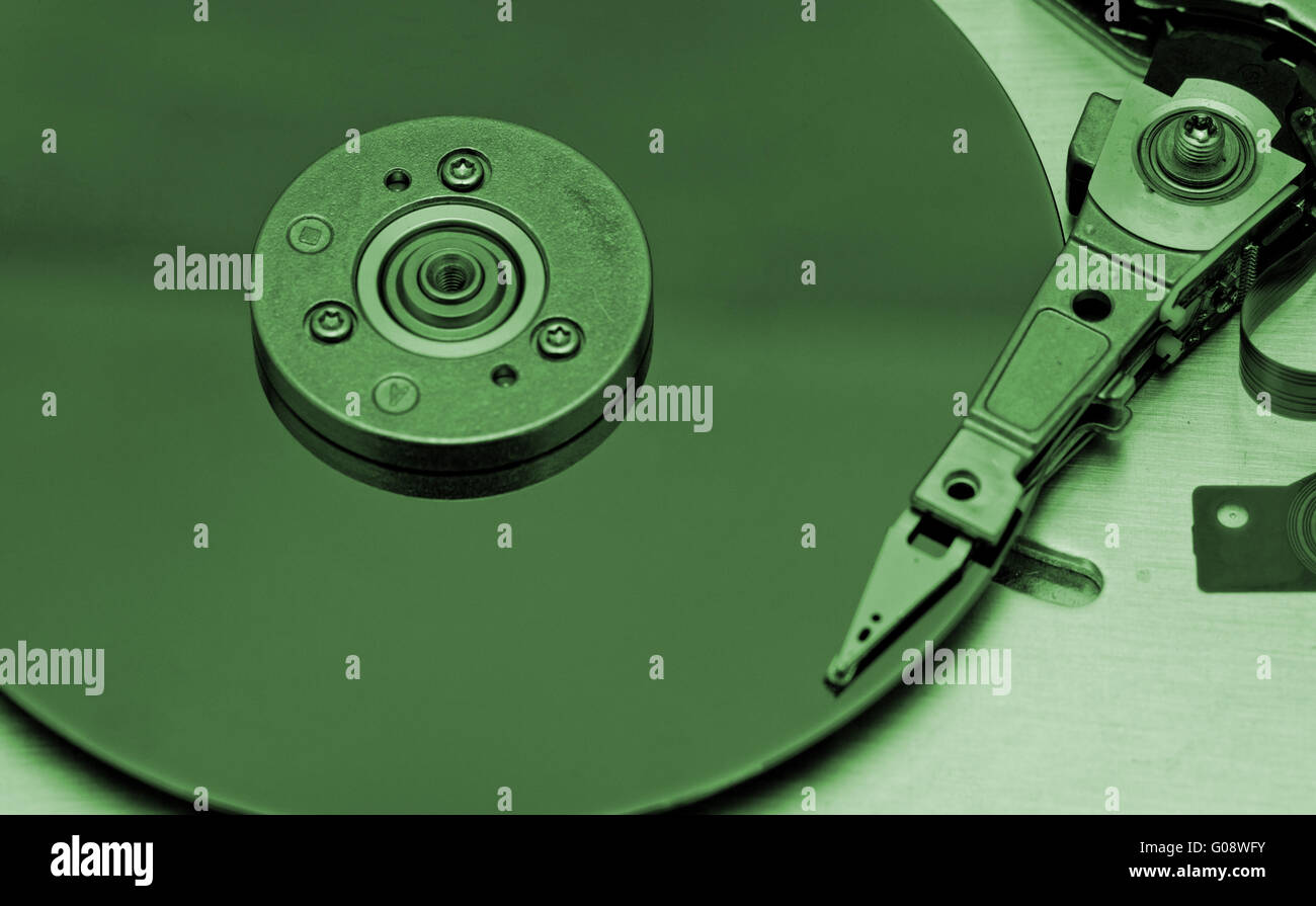 Open computer hard drive on white background with green (HDD Stock ...