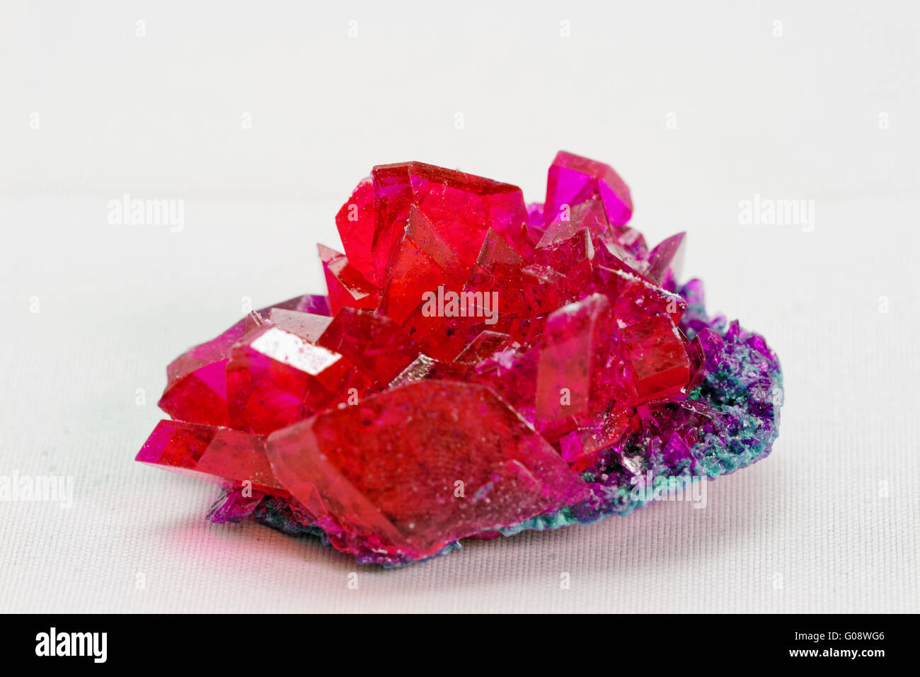 close up of crystals in ruby color on white background (red crystal ...