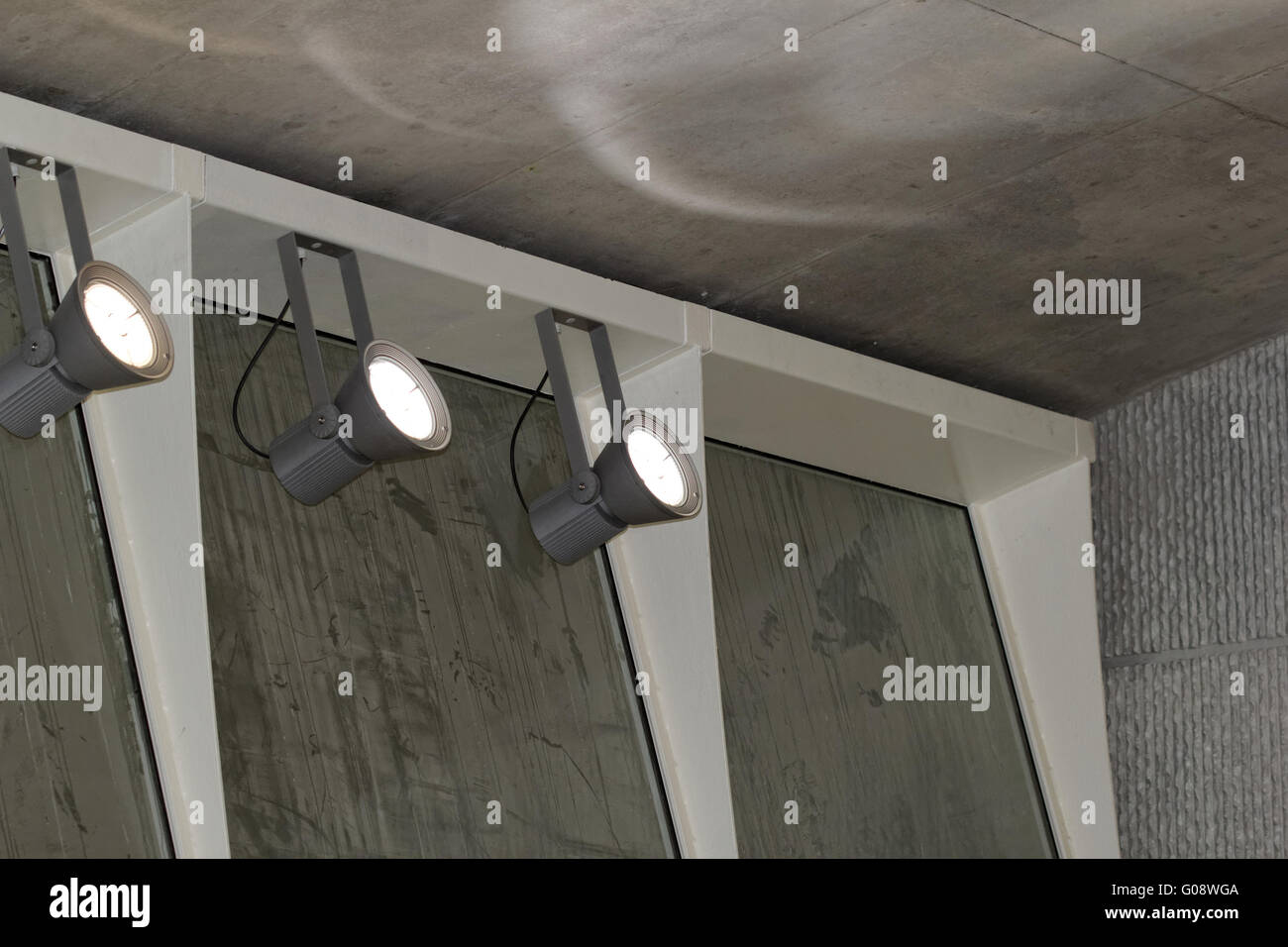 industrial lights on the wall inside a building Stock Photo - Alamy