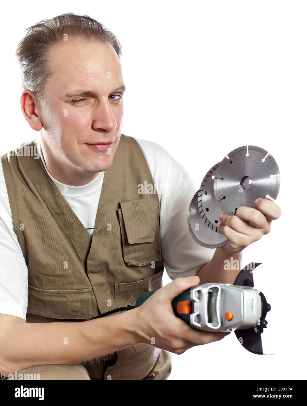 man in working overalls with the detachable machin Stock Photo - Alamy