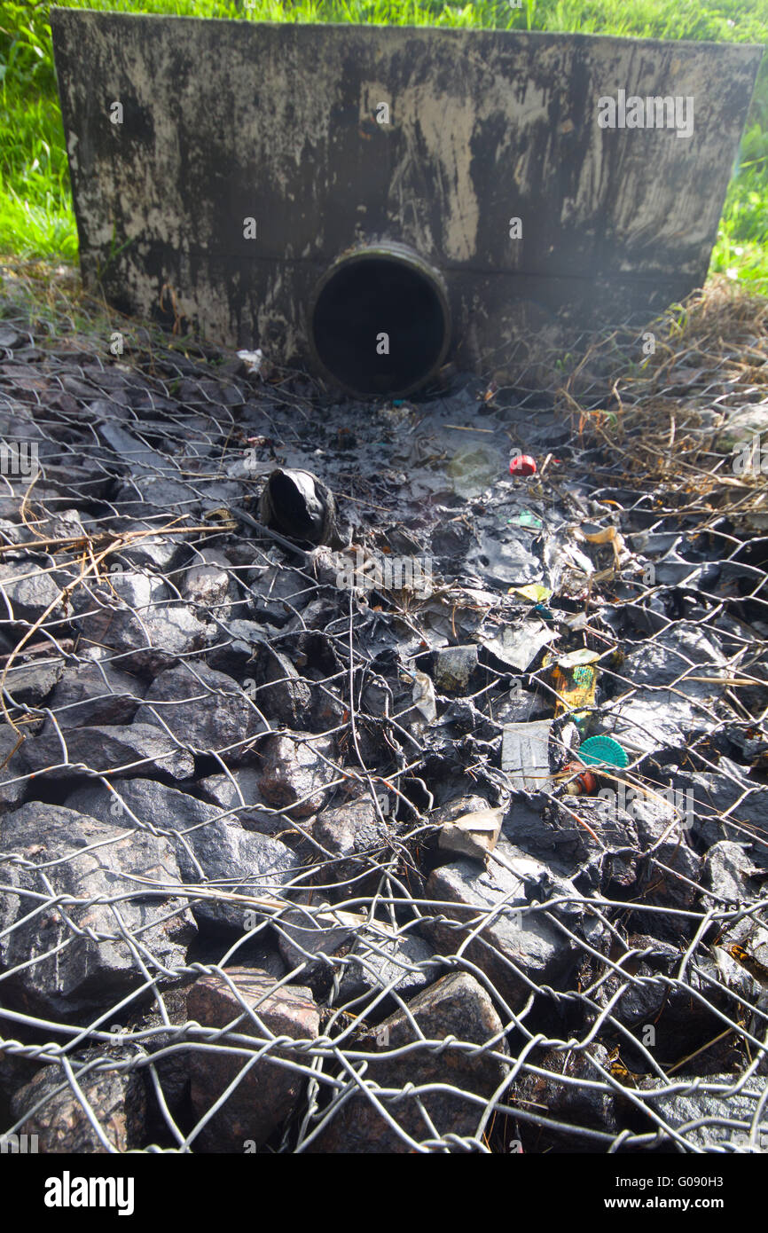 environmental pollution. engine oil from a pipe Stock Photo - Alamy