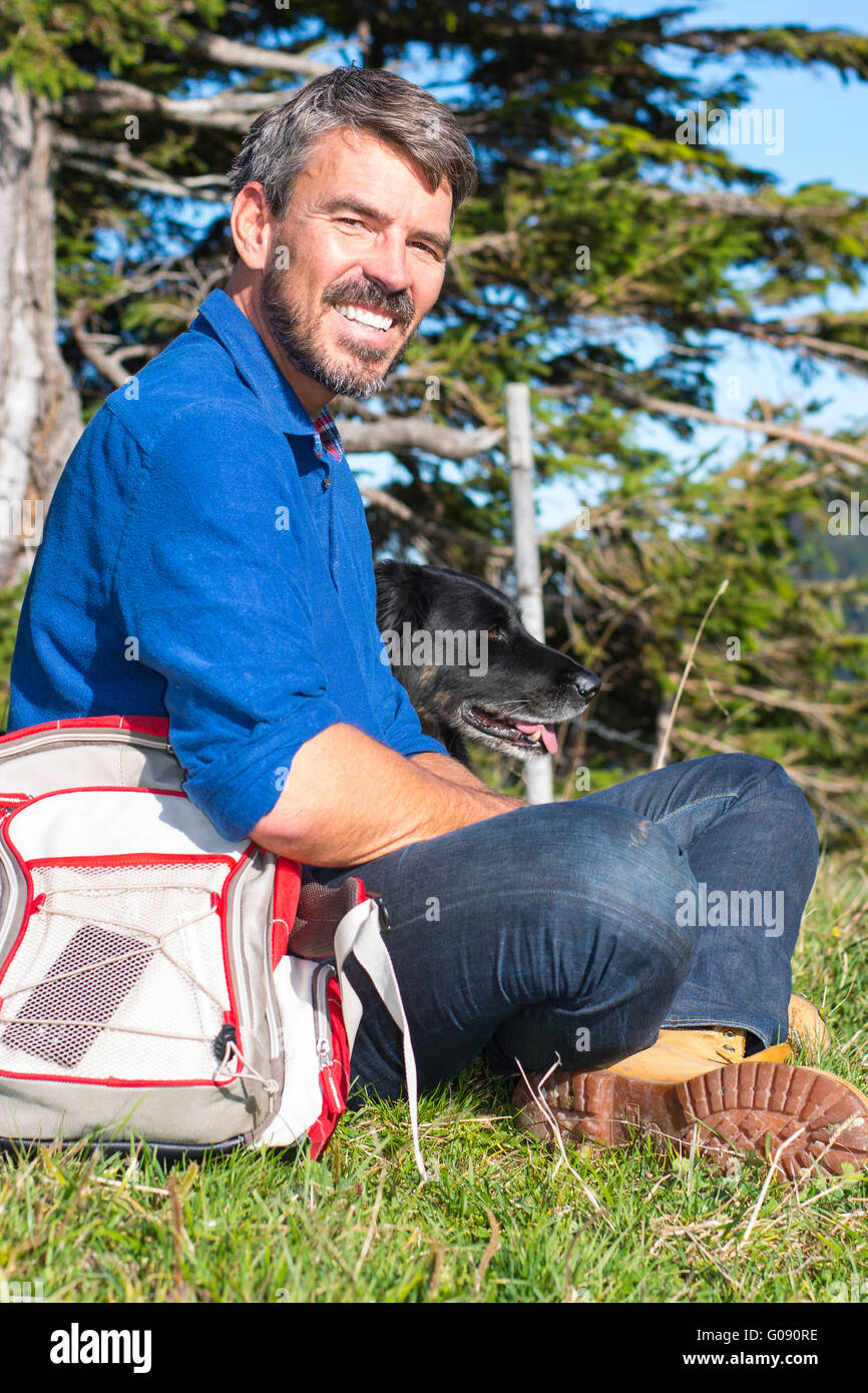 Man having a break while hiking Stock Photo - Alamy