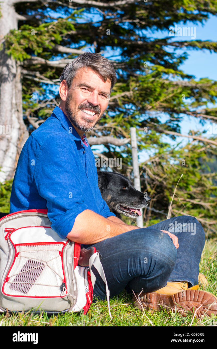 Man having a break while hiking Stock Photo - Alamy