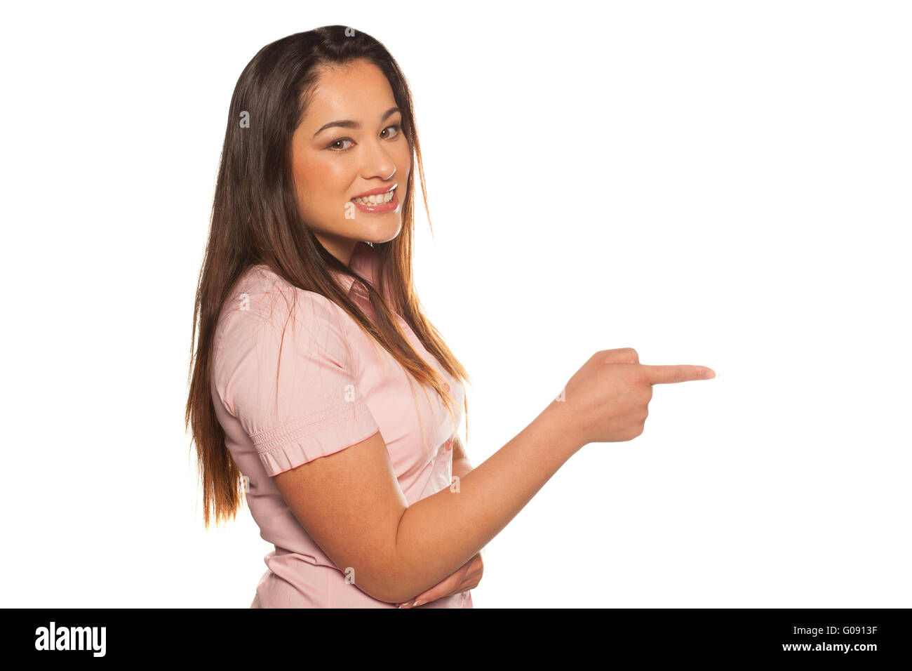 Profile portrait of a happy young woman pointing Stock Photo - Alamy