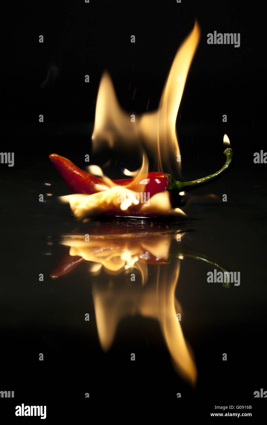 Flaming Hot Pepper on a black background Stock Photo - Alamy