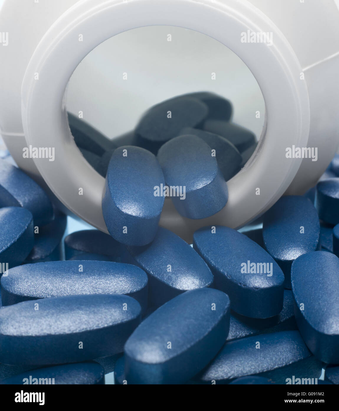 Spilled Capsules From White Bottles Stock Photo - Alamy